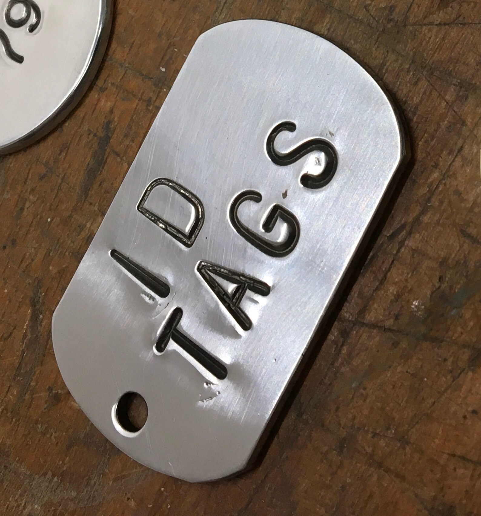 Custom hand stamped brass and aluminium tags quirky not - Etsy.de