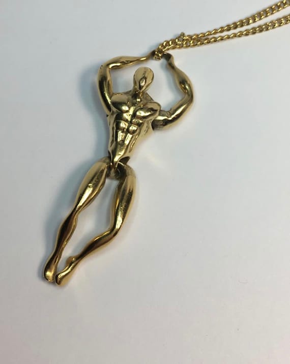Rare! Gold-plated bodybuilder puppet pendant from the… - Gem