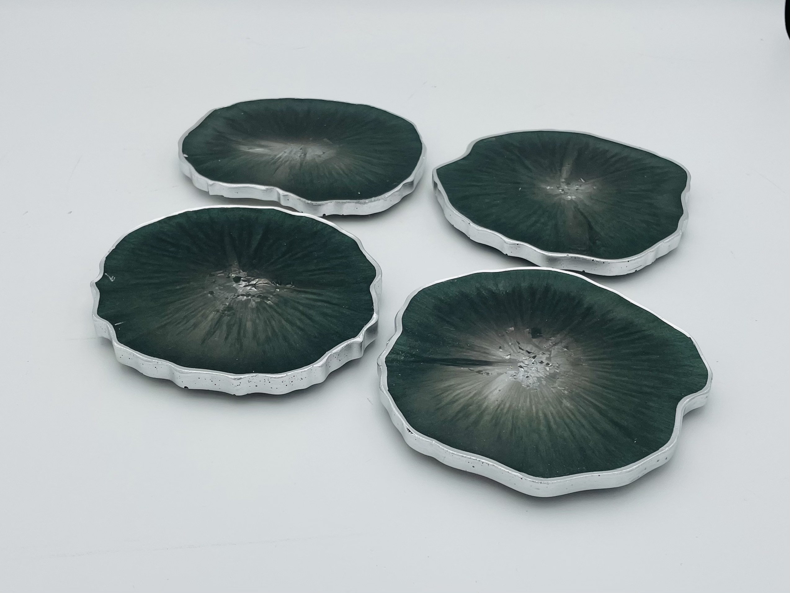 Deep emerald green resin coasters with gold or silver accents | Etsy