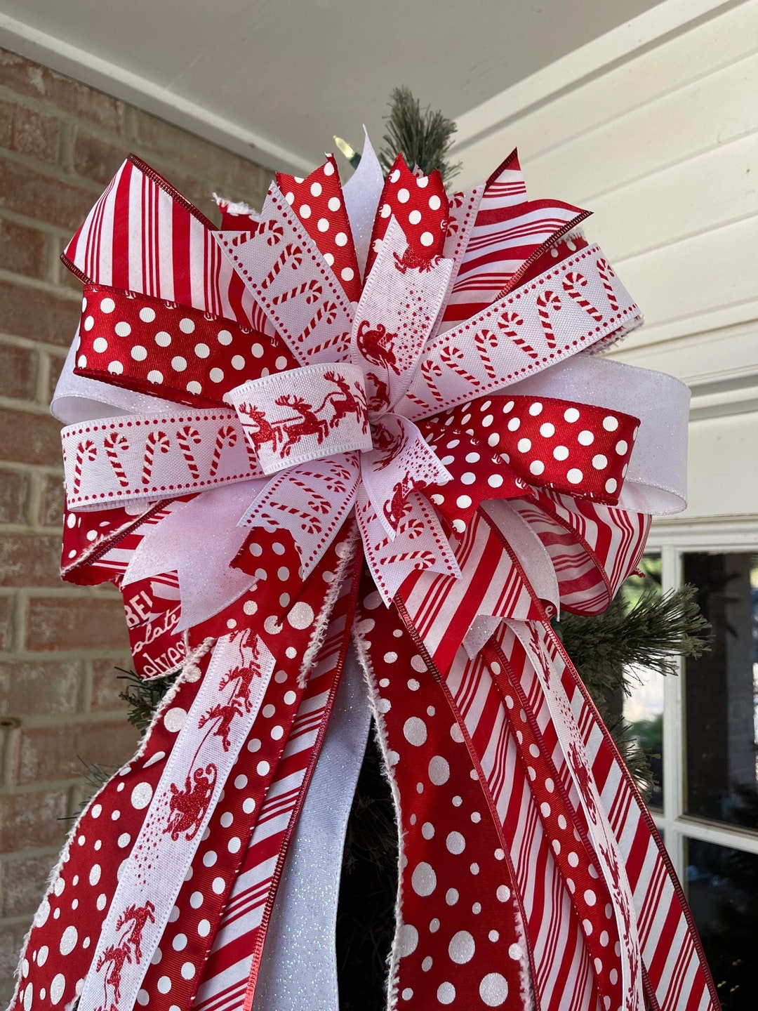 Large Christmas Peppermint Tree Topper Designed With Red White Ribbons ...