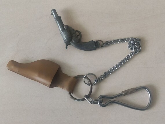 Vintage souvenir keychain revolver in a holster with … - Gem
