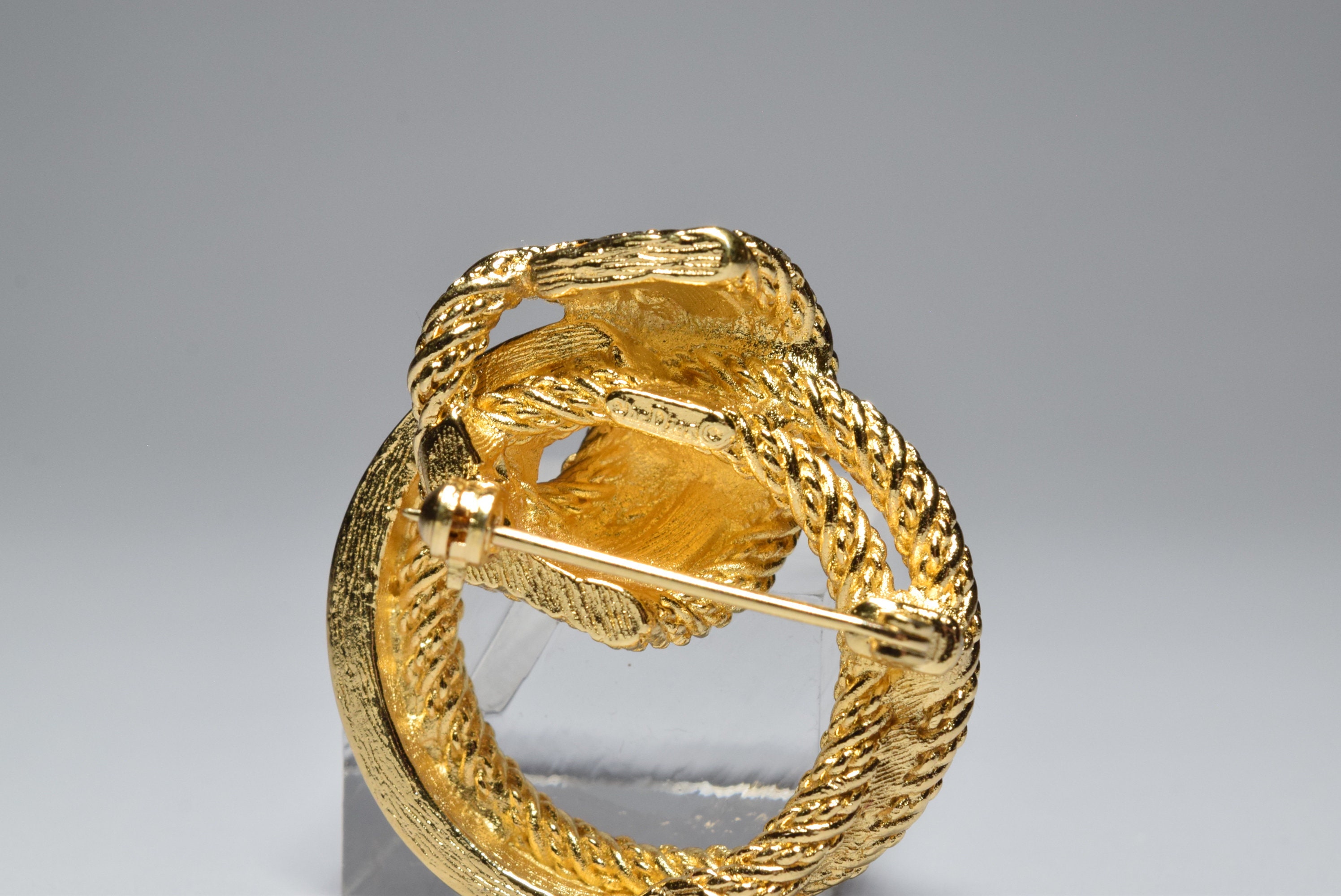 Vintage Collection Gold Tone Christian Dior 1970s Knot Clear Vintage Collection Gold Tone Christian Dior 1970s Knot Clear