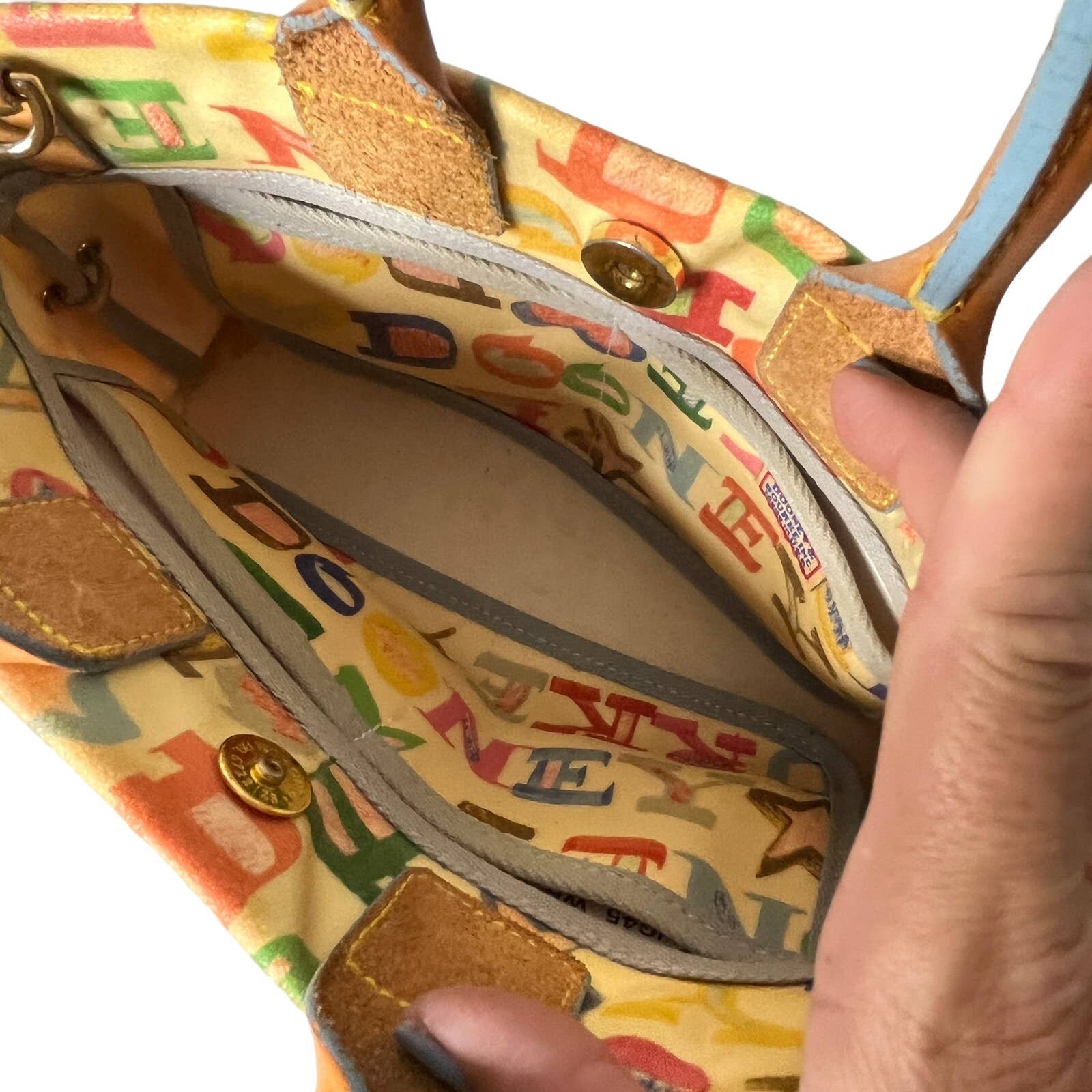 Dooney & Bourke Vintage Rainbow Signature Coated Canvas Baguette ...