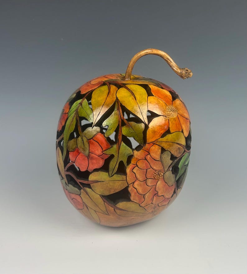 Large Orange Flowers and Trailing Leaves Surround This Gourd With Stem ...