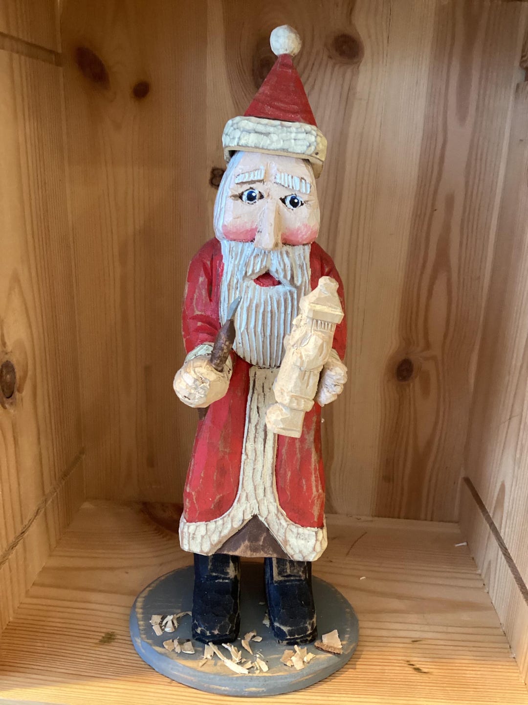 Santa is a Wood Carver, Wood Carved Santa Holding a Carving Knife and ...