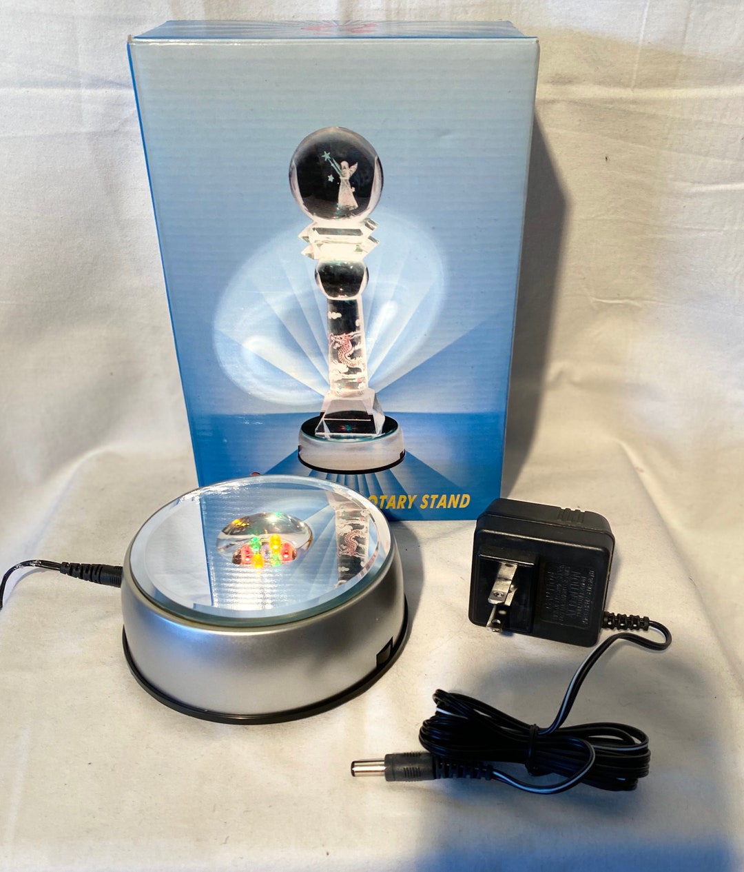 Rotating Lighted Display Stand With Silver Base - Multi Colored LED ...