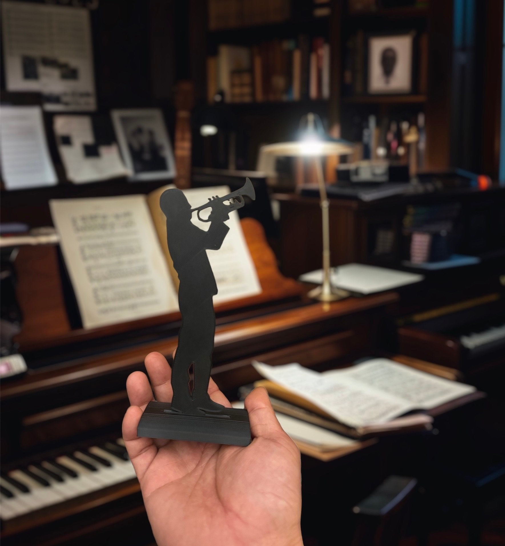 A Small Black Plastic Figurine of the Shadow Silhouette of an Jazzman ...