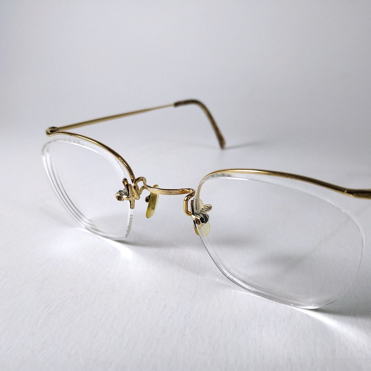 Vintage rimless gold frame eyeglasses, celluloid nose piece, oldies but ...