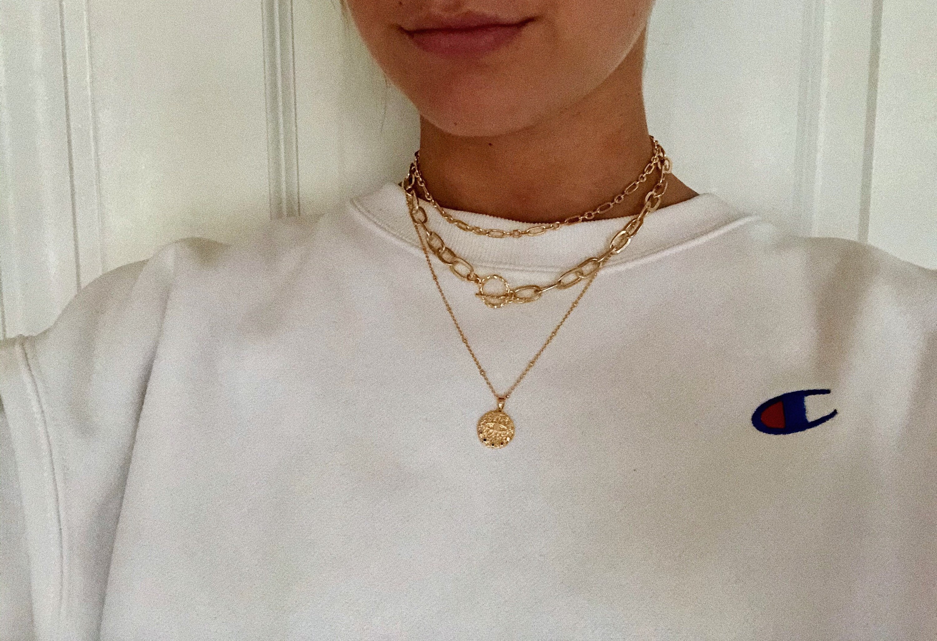 Gold evil eye coin with rainbow gems necklace