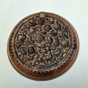 An Antique Indian Copper Wall Hanging Plate Profusely Decorated With a ...