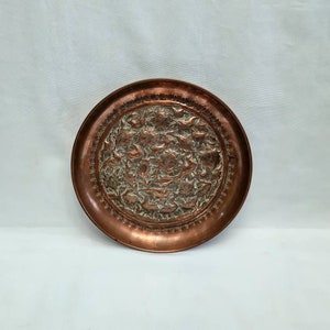 An Antique Indian Copper Wall Hanging Plate Profusely Decorated With a ...