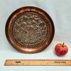 An Antique Indian Copper Wall Hanging Plate Profusely Decorated With a ...