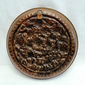 An Antique Indian Copper Wall Hanging Plate Profusely Decorated With a ...