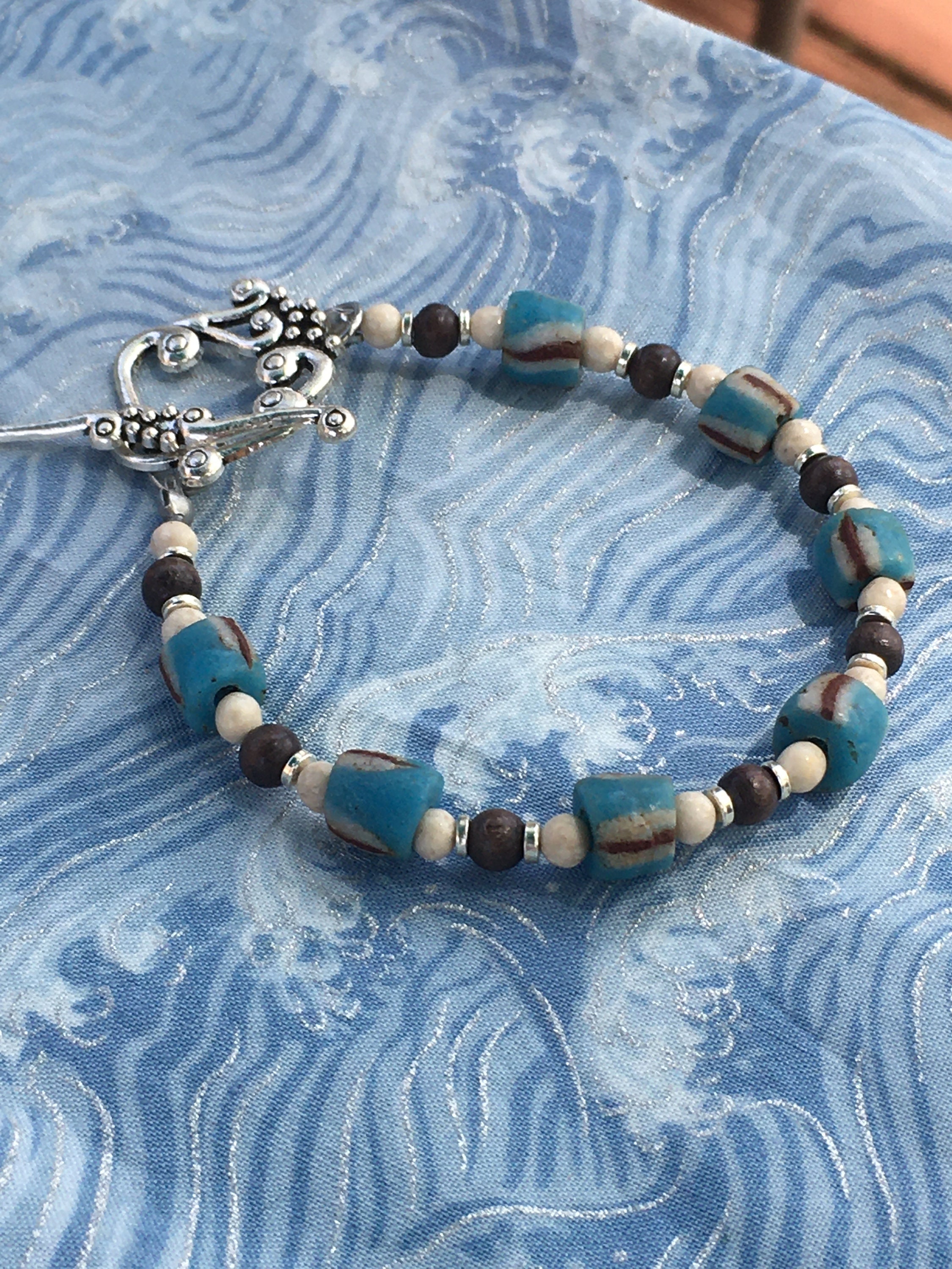 Light blue and earthy tone single strand handcrafted beaded - Etsy.de