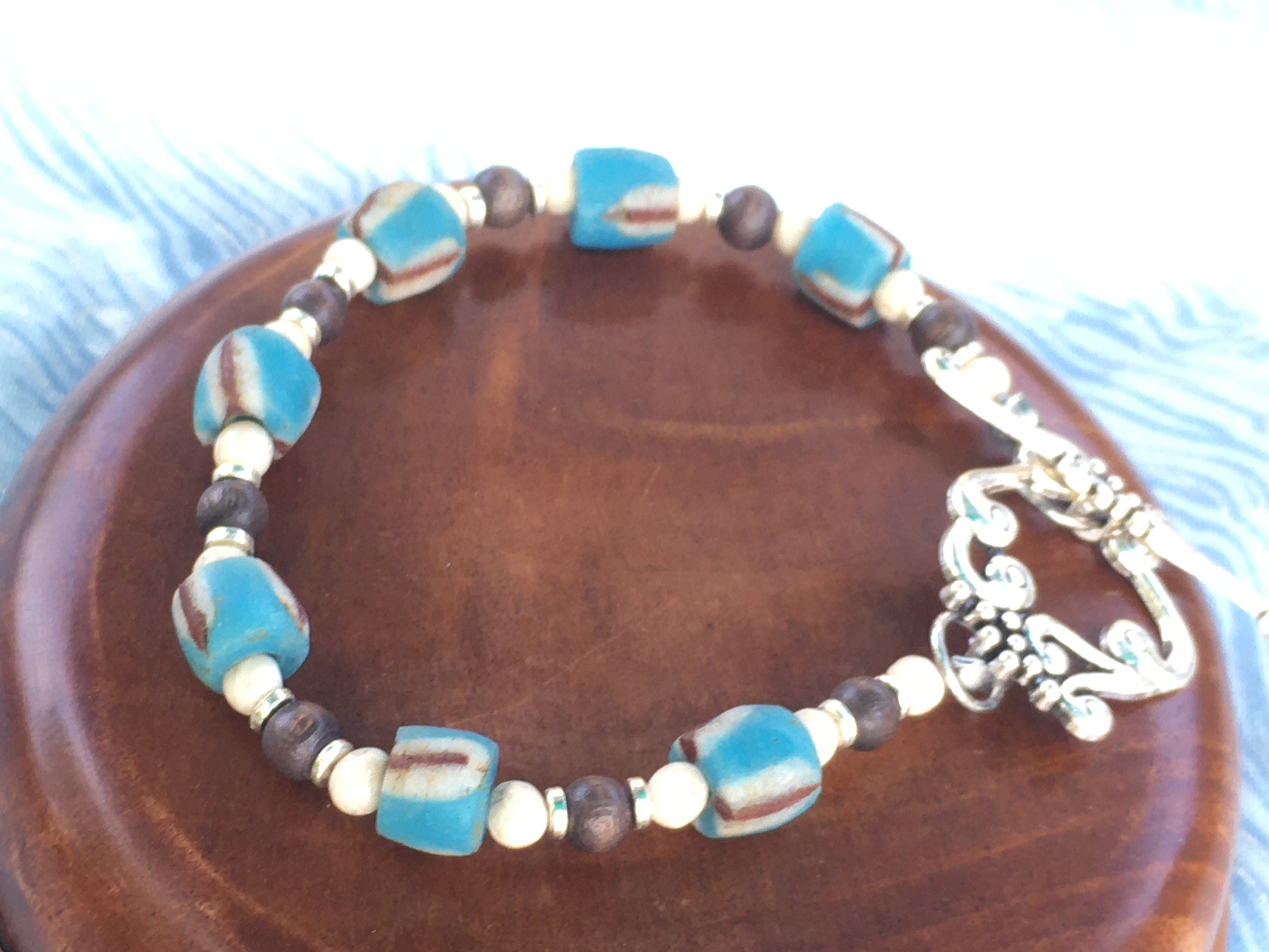 Light blue and earthy tone single strand handcrafted beaded - Etsy.de