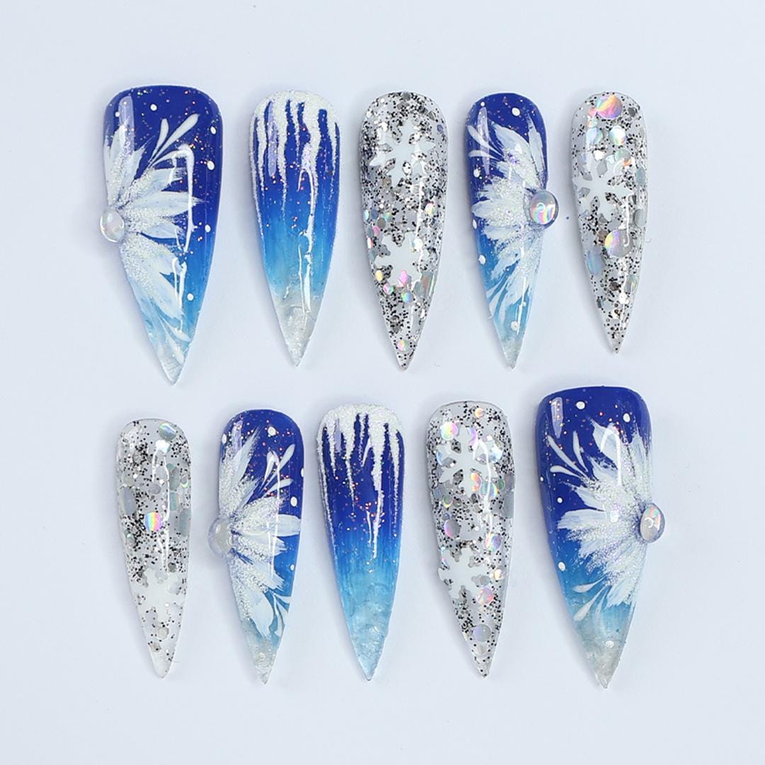 Winter Elegance: Long Stiletto Press-on Nails Adorned With White ...