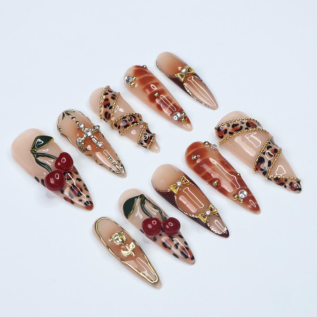 Leopard Luxe Almond Presson Nail With Gold Details and 3D Cherry Gel ...