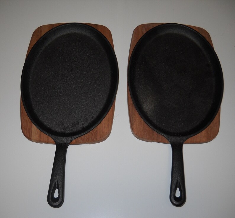 Used Once Condition Tramontina Sizzling Cast Iron, 2 Hardwood Trivet ...