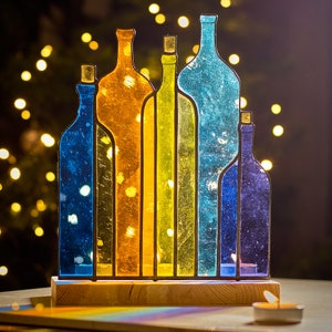 Colorful Bottles Stained Glass Table Stand on the Wooden Platform ...