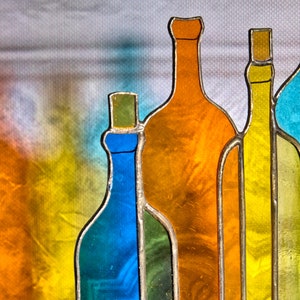 Colorful Bottles Stained Glass Table Stand on the Wooden Platform ...