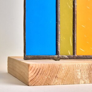 Colorful Bottles Stained Glass Table Stand on the Wooden Platform ...