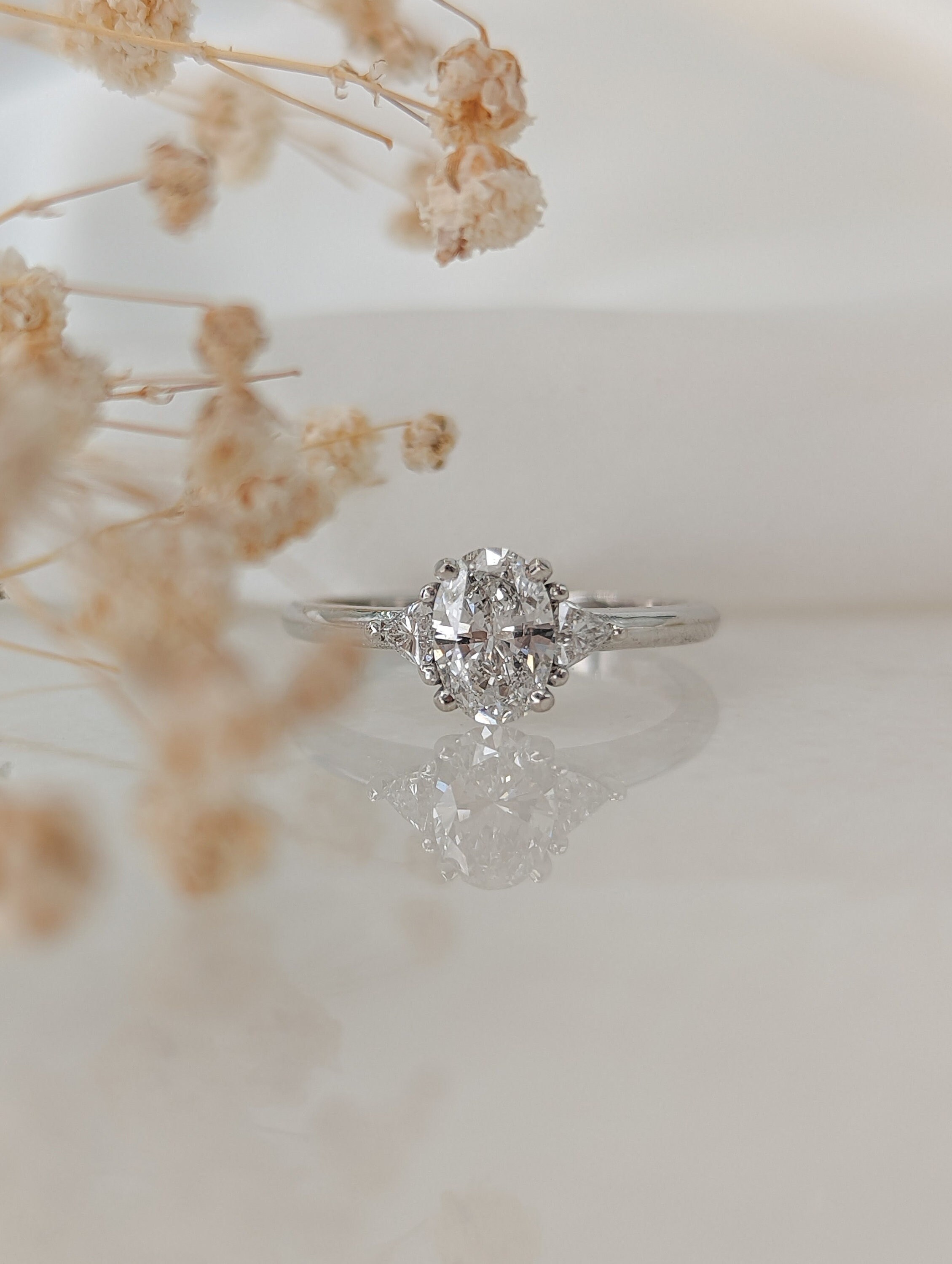 Carats Oval Cut With Pear Shape Side Stones Diamond