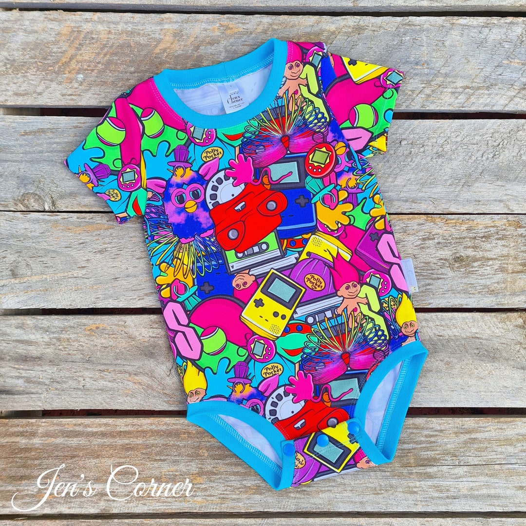 90's Kid, Polly Pocket, Trolls, Grip Ball, Turtles, Gameboy Bodysuit ...