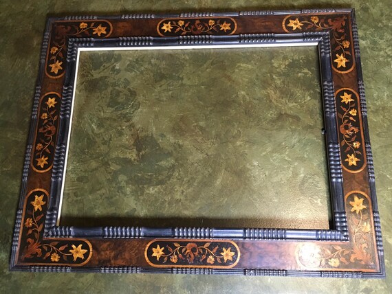 Hand crafted 17th century Dutch style ripple molded and marquetry frame.