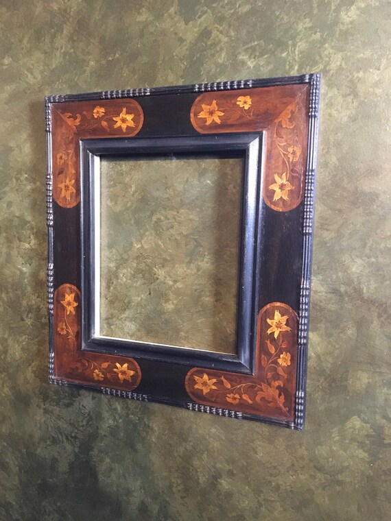 Hand crafted 17th century Dutch style ripple molded and marquetry frame.