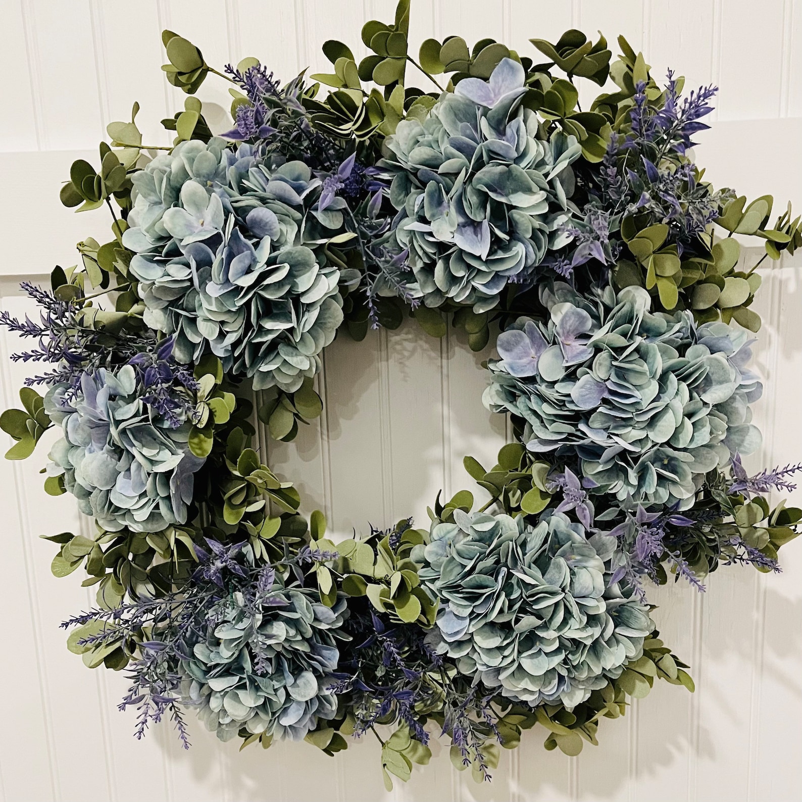 A Beautiful Blue Hydrangea Wreath With Sprigs of Lavender is Made on a ...