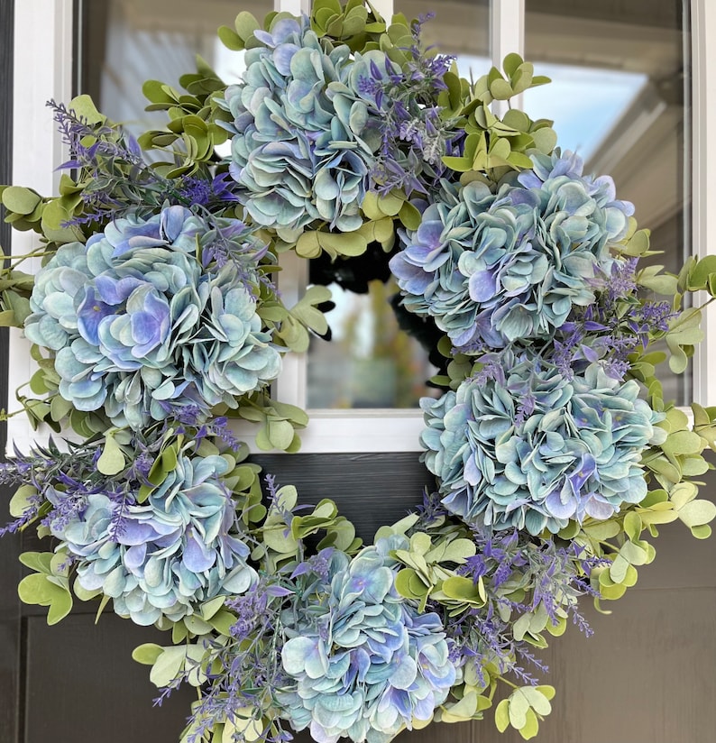 A Beautiful Blue Hydrangea Wreath With Sprigs of Lavender is Made on a ...