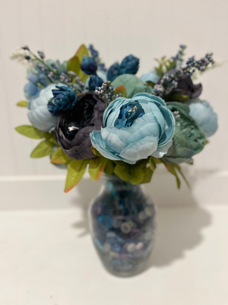 Beautiful Shades of Blue Flowers in a Clear Glass Vase, Filled With ...