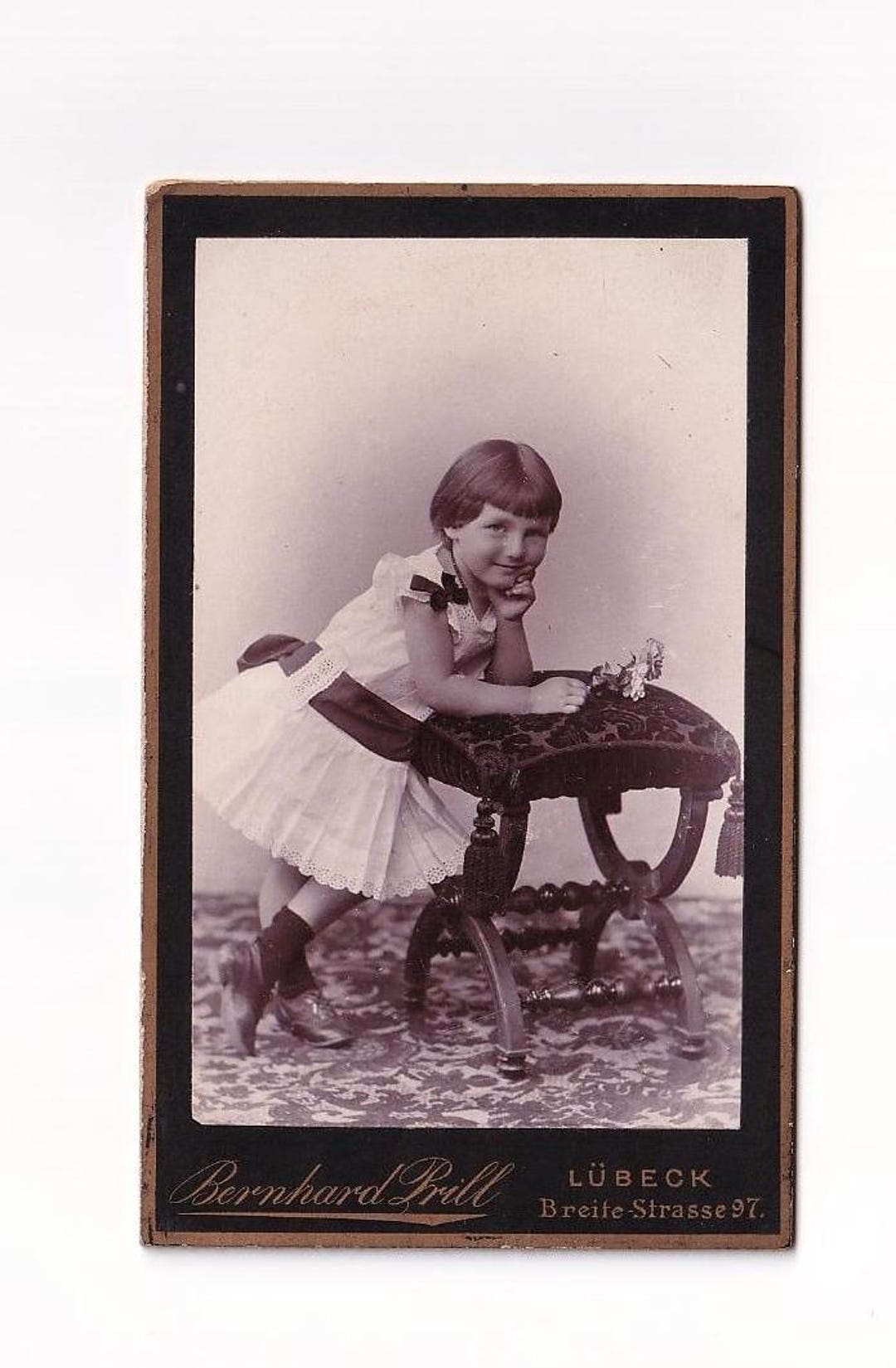 Smiling Girl With Bangs in a White Lace Dress, German Visit Photo ...