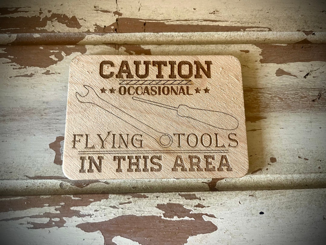 Caution. Occasional Flying Tools in This Area. Funny Workshop or ...