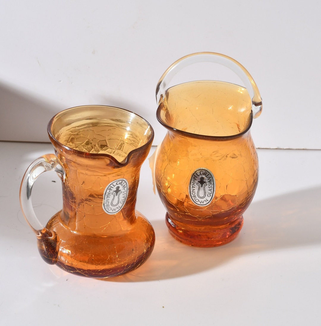 A Pair of Vintage Crackle Glass Amber Pilgrim Glass With Labels Pitcher ...