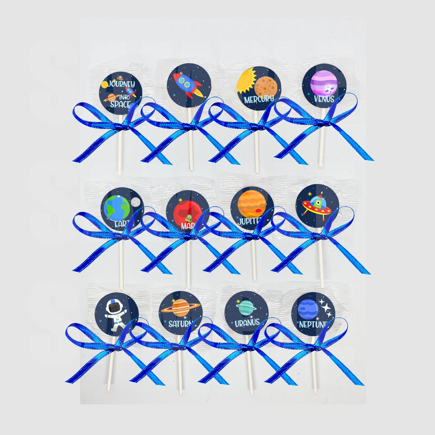 Journey Into Space Lollipops With Blue Satin Ribbon Bows Rocket ...