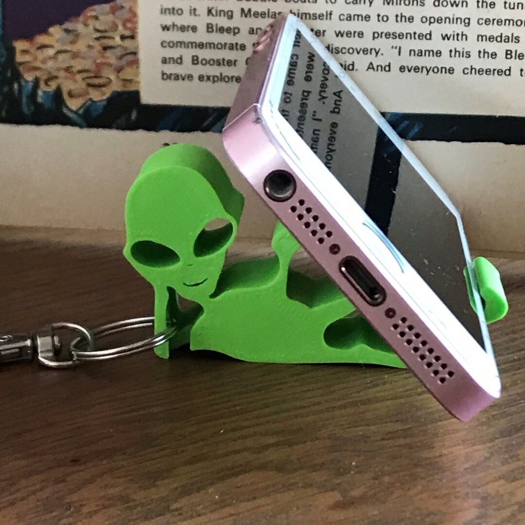 Phone Stand of Alien With Keyring, Grey and Green Alien Holding Phone ...