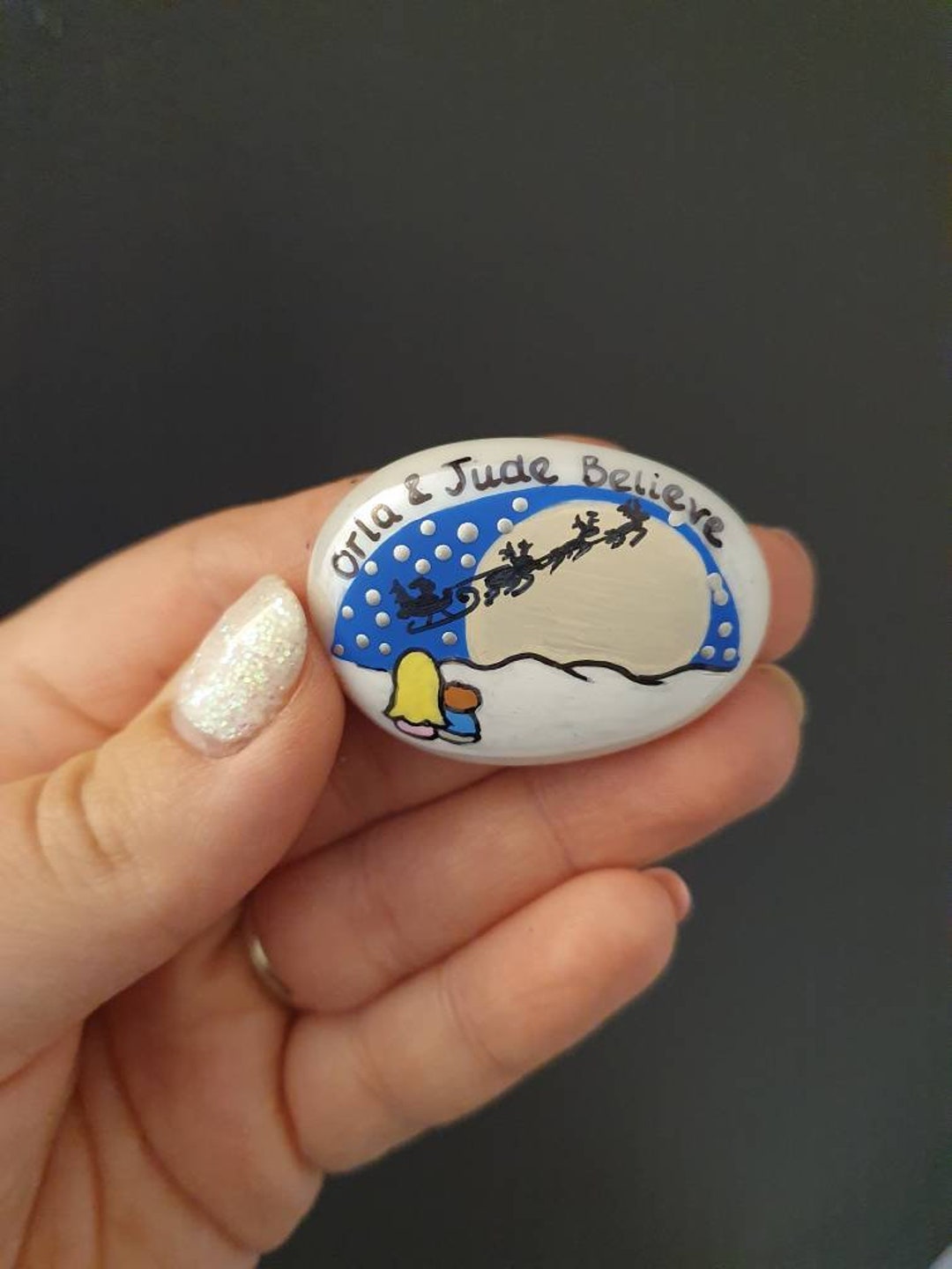 Personalised Christmas 'believe' pebbles . Santa in sky reindeer flying ...
