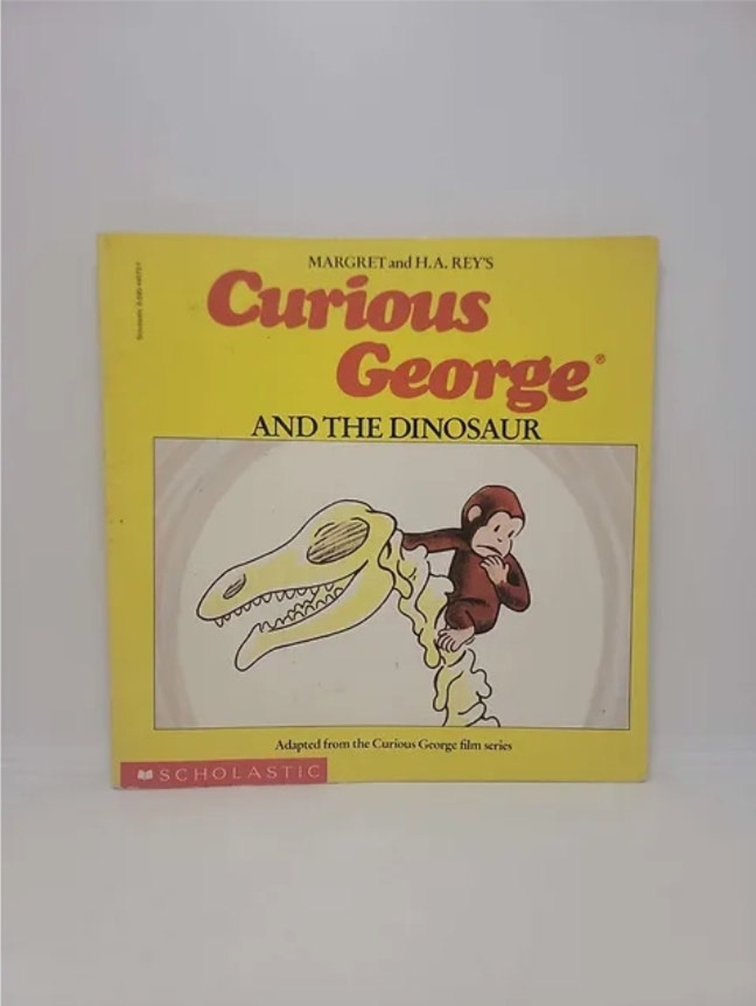 Curious George and the Dinosaur Paperback – October 29, 1990 by H. A ...
