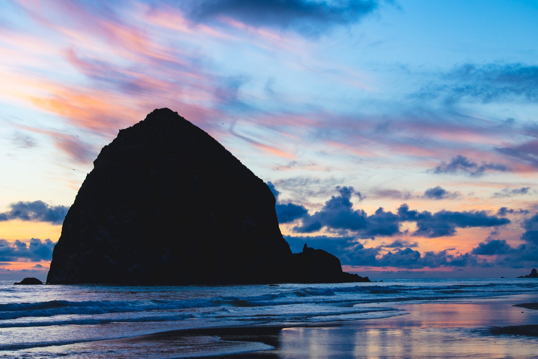 Haystack Rock at Cannon Beach in Oregon Colorful Beautiful Skies and ...