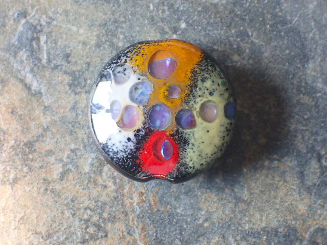 A Round, Flat, Black Glass Focal Bead With Multi-colored Enamels and ...