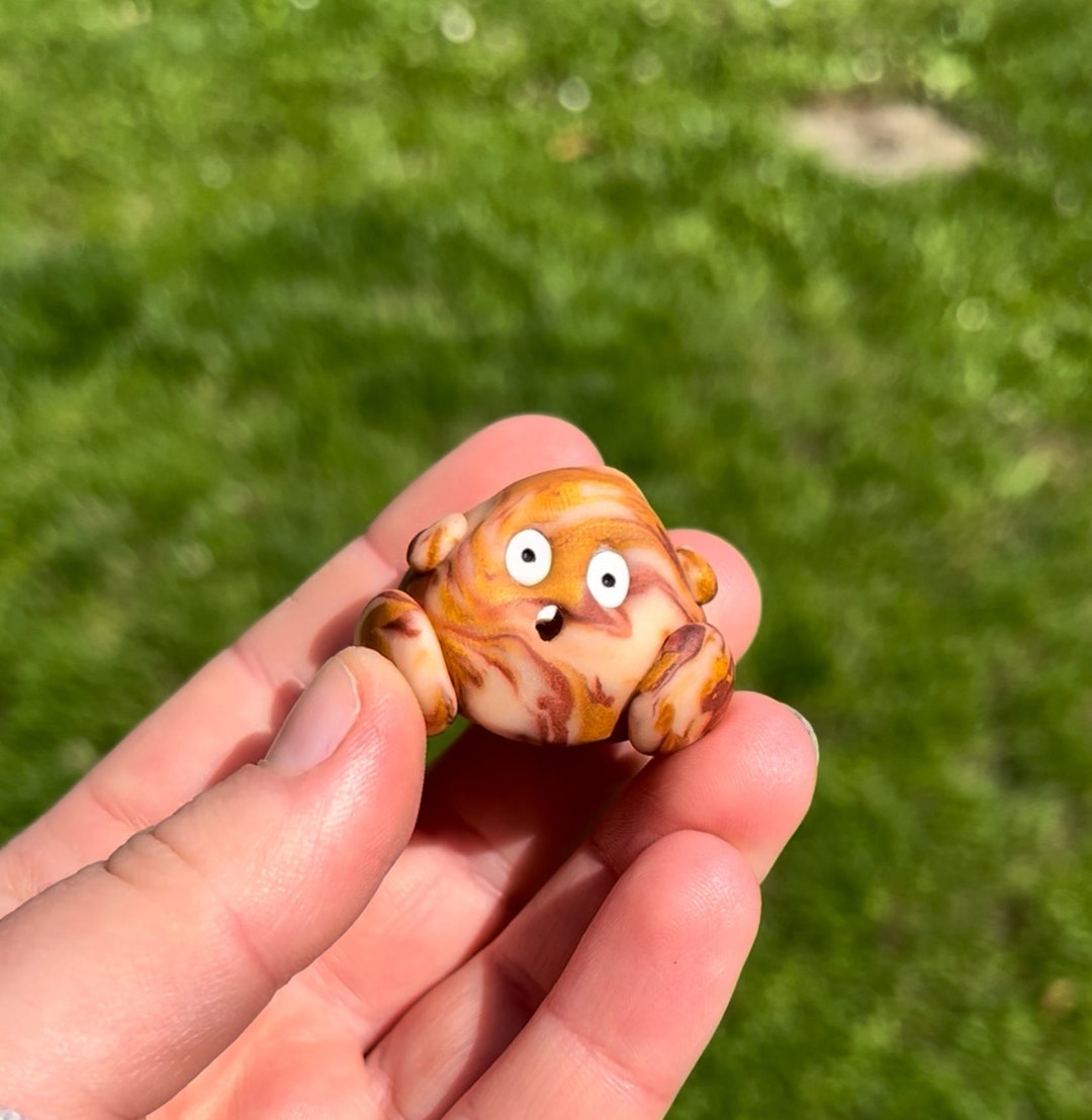 Confused Cute Clay Figurine Cheeky Gold Plant Pebble With 1 Tooth ...