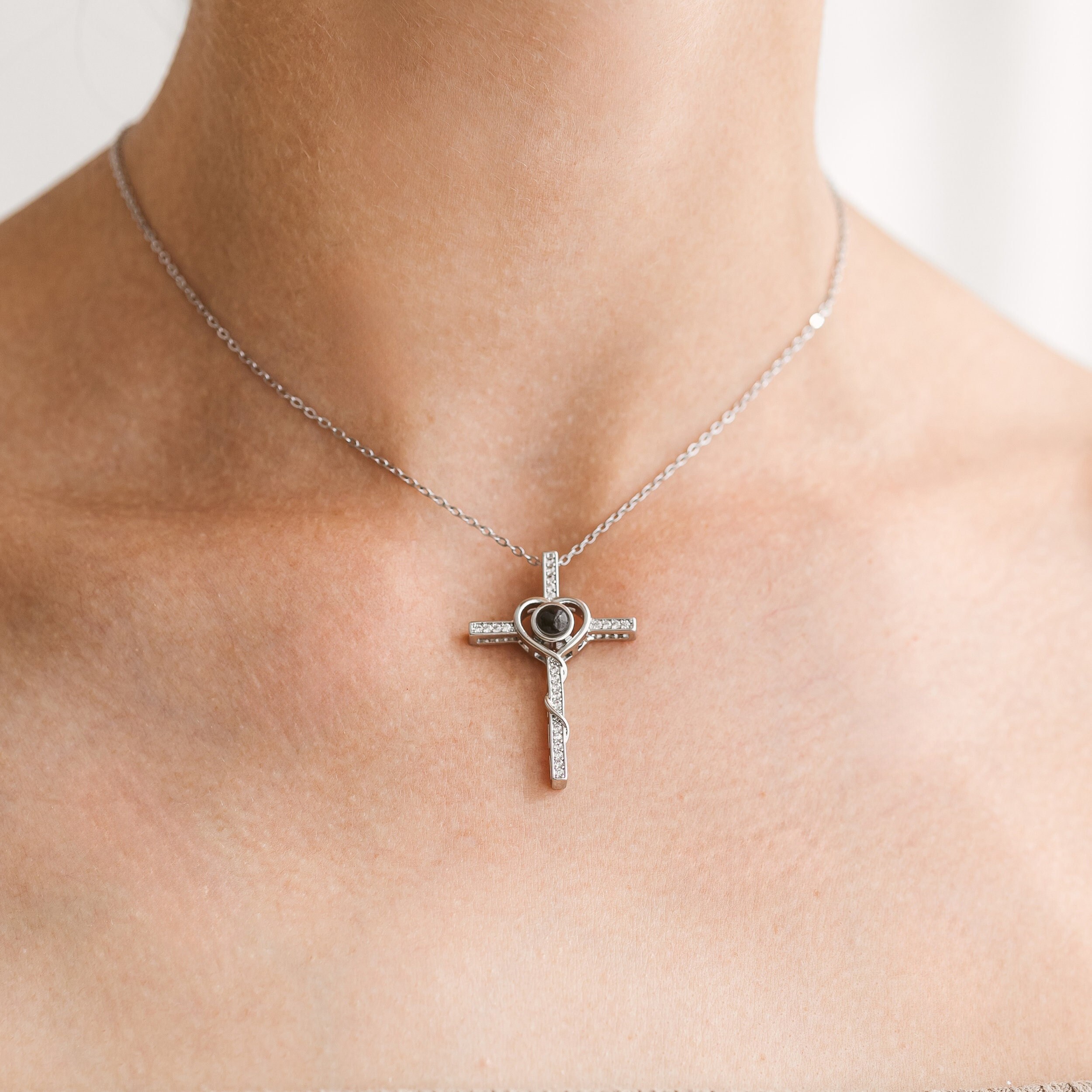 Cross projection necklace store