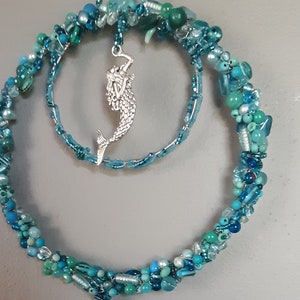 Teal Wall Hanging- Silver Mermaid, Swimming Within a Set of Circles ...