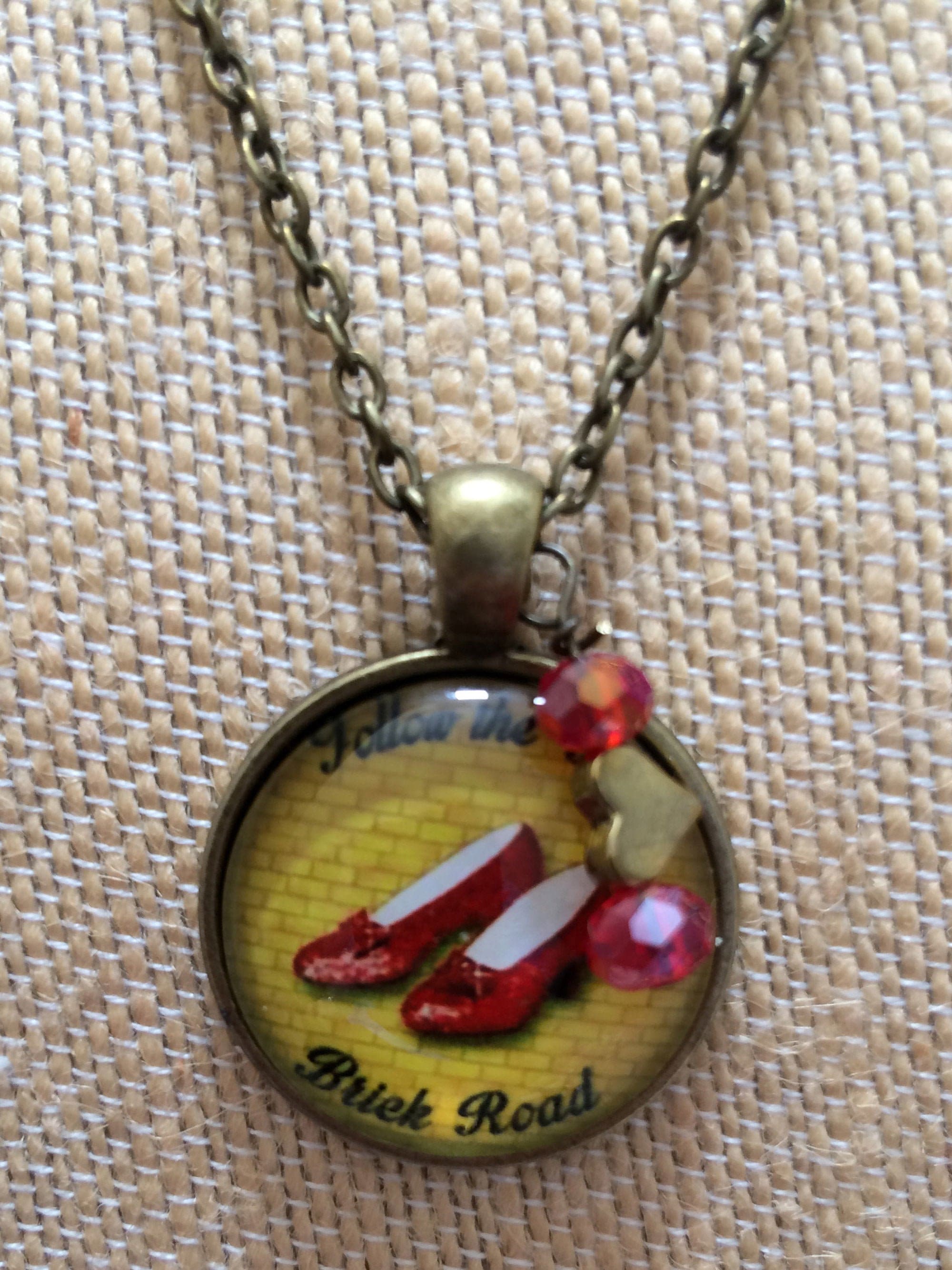 Wizard of Oz Ruby Slippers Necklace, Antique Gold Metal, "follow the ...