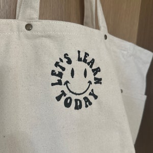 Lets Learn Today Smiley Face Embroidered Washed Canvas Tote Bag With ...
