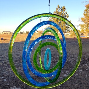 Colorful Spinning Glass Circle Garden Art, Blue & Green Clear Ring ...