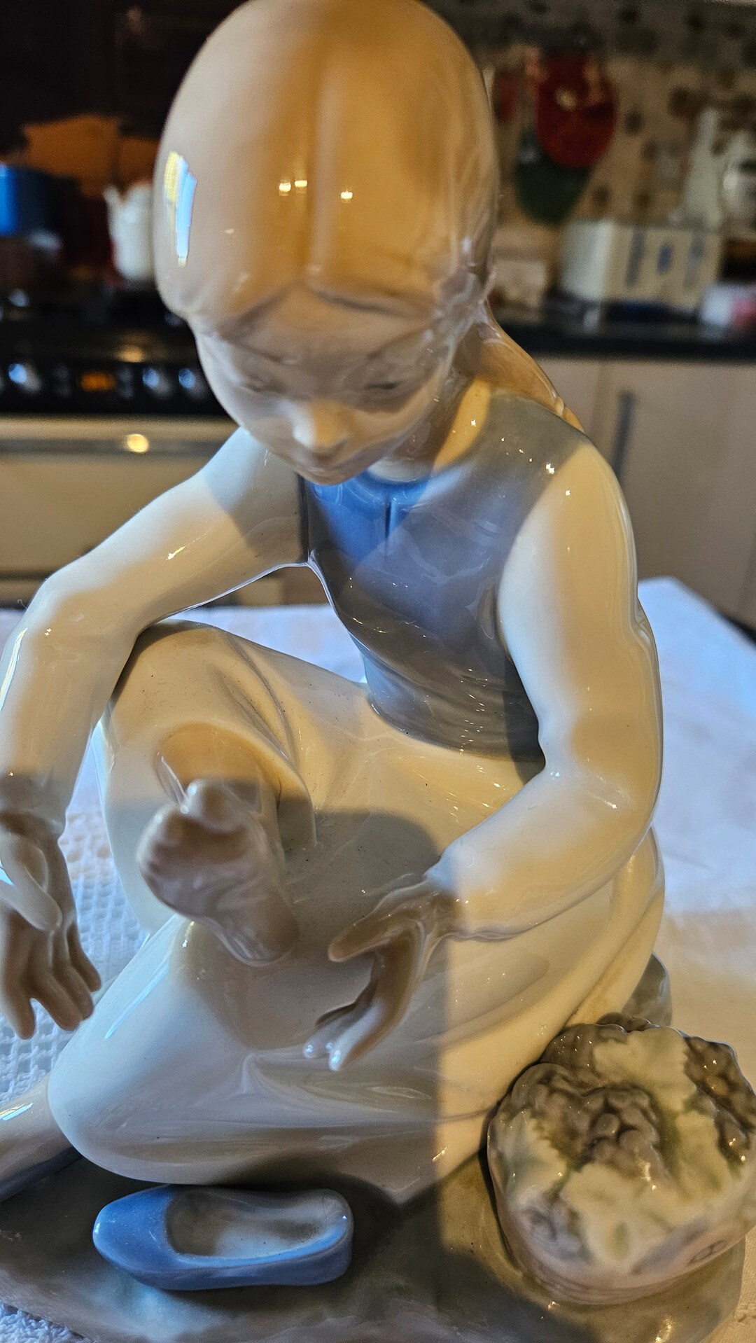 NAO Ladro Sitting Girl Washing/rubbing Her Foot With Basket Blue White ...