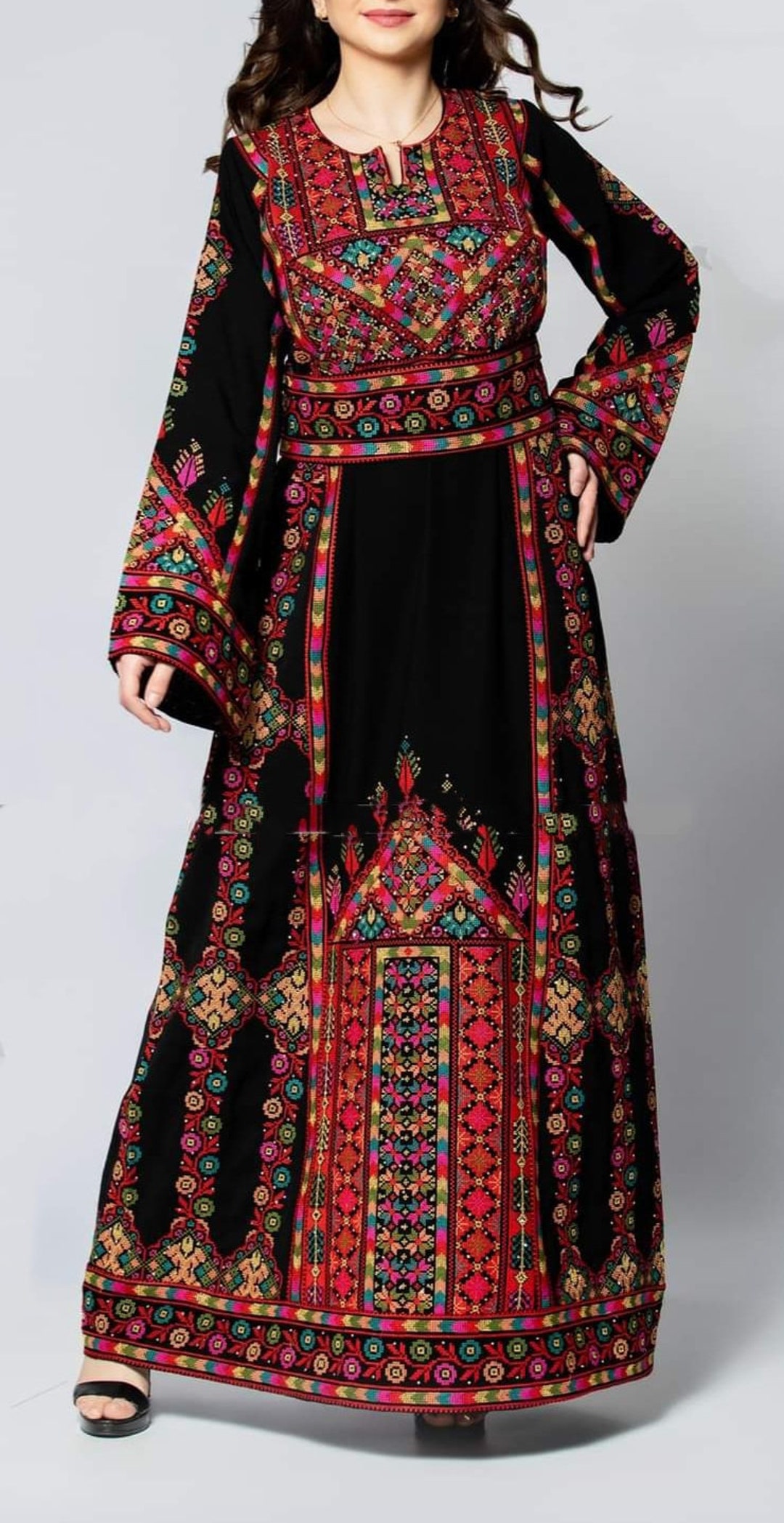 An Embroidered Dress With Heavy Hand Embroidery, A Mix of Colors With A ...