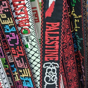 An Embroidered Bag Strap With A Traditional or Geometric Pattern ...